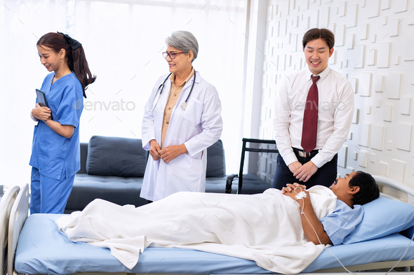 Hospital treatment room relative visit patient lay on bed doctor ...