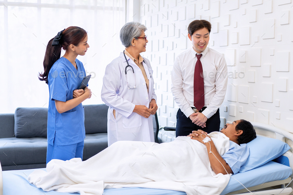 Hospital treatment room relative visit patient lay on bed doctor ...