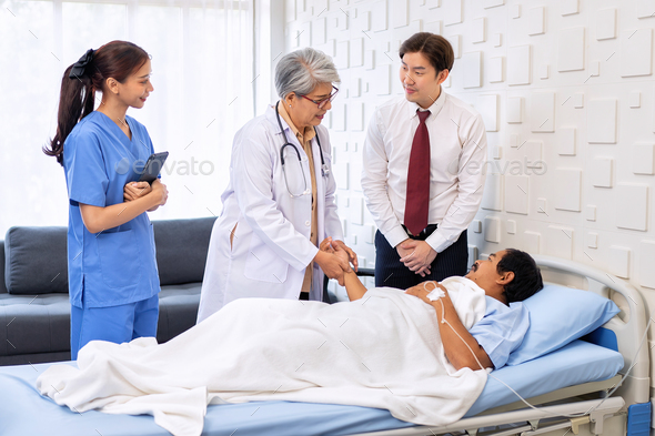 Hospital treatment room relative visit patient lay on bed doctor ...