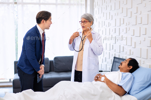 Hospital treatment room relative visit patient lay on bed doctor ...
