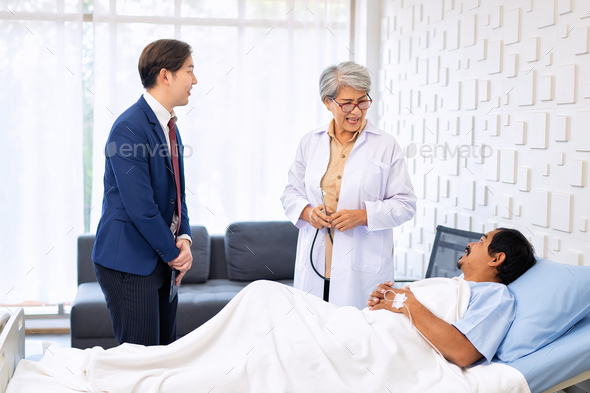 Hospital treatment room relative visit patient lay on bed doctor ...