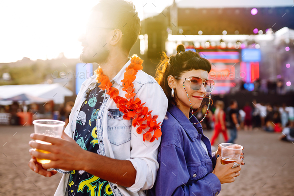 Group of friends with beer dancing and having fun at music festival ...