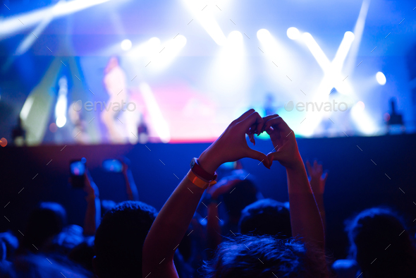 Heart shaped hands at concert, loving artist and festival. Music ...