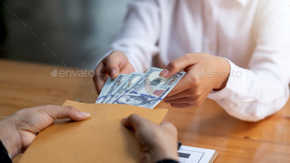 Business people giving bribe and collaborating with corruption. Bribery ...