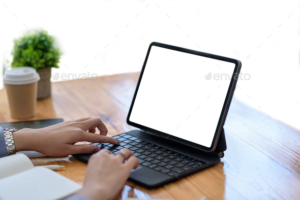 Close up of Woman hand using computer tablet blank white screen on ...