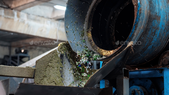 Sorting glass garbage at waste sorting plant Stock Photo by frimufilms