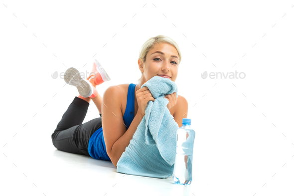 Sport caucasian woman relax with towel and water after hard workout ...
