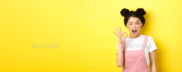 Alright. Confident asian female model with bright makeup and summer ...