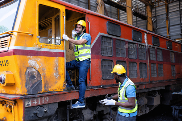 Railroad train maintenance engineer walkie talkie call giving signal to ...