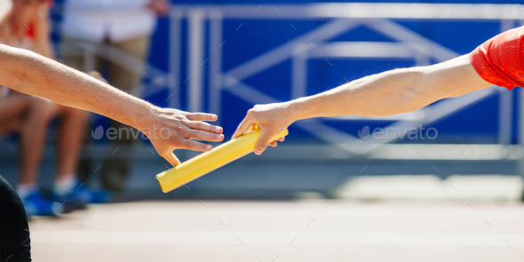 hand men passing baton running relay race in summer athletics ...