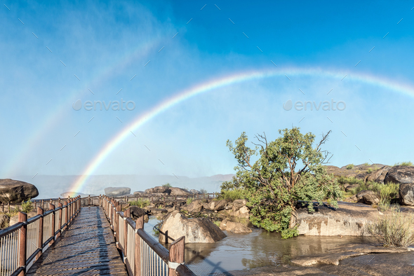 Rainbow over boardwalk at Augrabies Falls Stock Photo by dpreezg ...