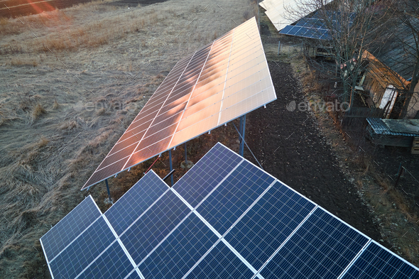 Solar photovoltaic panels mounted on stand-alone frame on backyard ...
