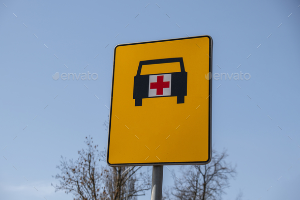 Road sign that shows way for ambulance. Ambulance yellow street sign ...