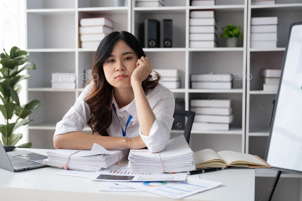 Overworked Asain Business Lady Sitting Stressed By A Lot Of Tasks At ...