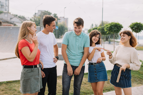 Summer holidays and teenage concept - group of smiling teenagers ...