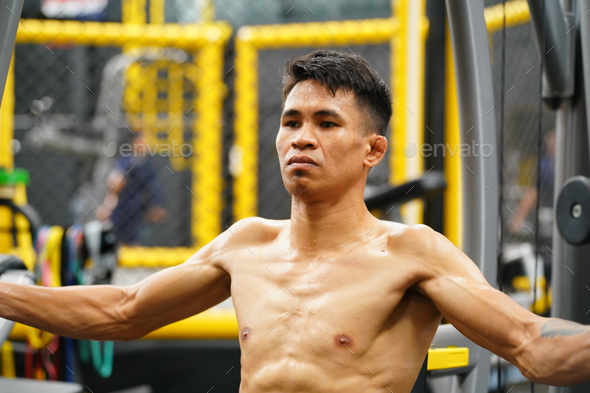 Mixed martial arts fighter going to the gym to build strong muscles ...