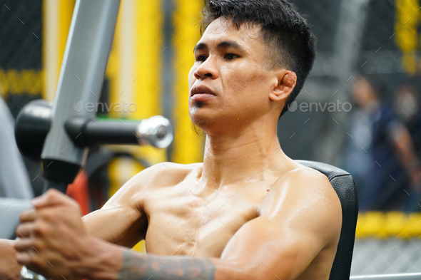 Mixed martial arts fighter going to the gym to build strong muscles ...