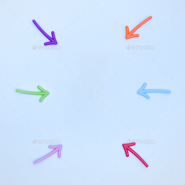 Multi-colored arrows pointing to the area between them on a light blue ...