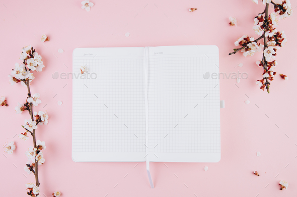 Spring flowers - cherry blossom, empty notebook on a pink table. Stock ...