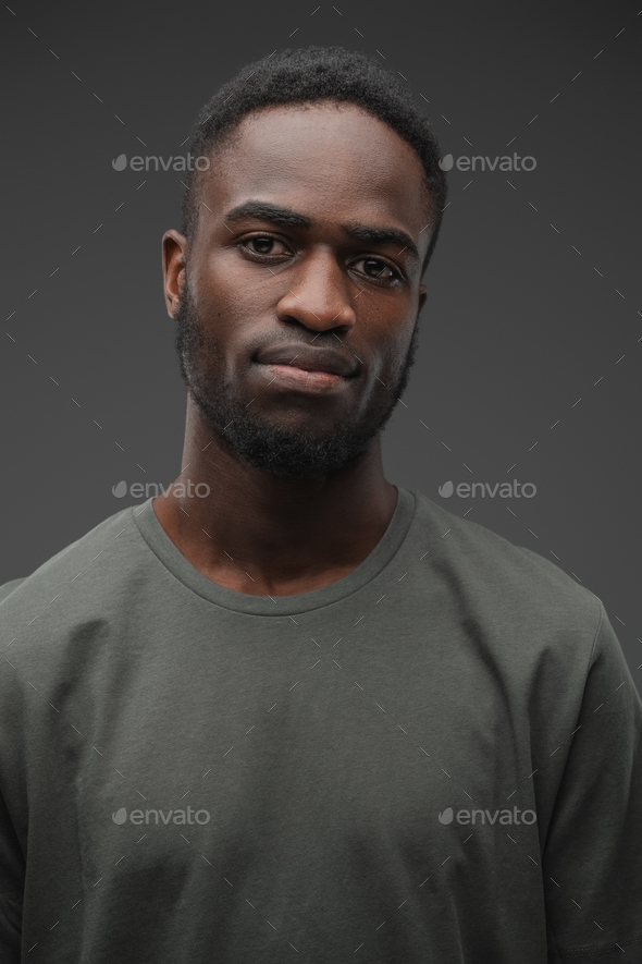 Cool african guy looking at camera against gray background Stock Photo ...