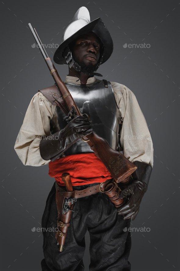 Medieval soldier with steel armor and flintlock musket Stock Photo by ...