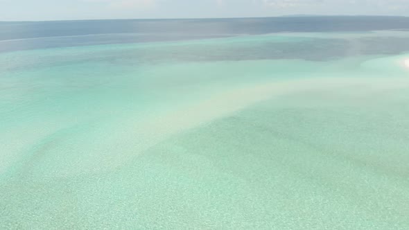 Aerial: Flying over idyllic atoll, scenic travel destination in ...
