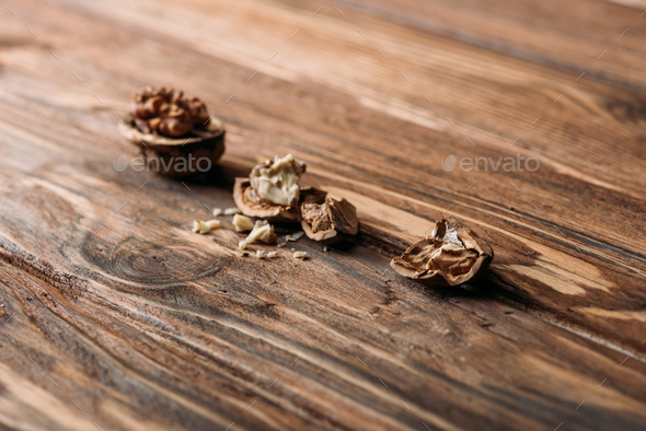 cracked walnuts in nut shells as dementia symbol on wooden table Stock ...