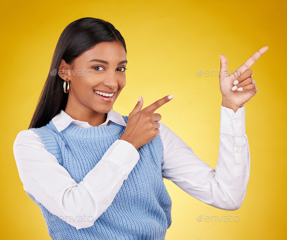 Woman, portrait and gun fingers in a studio pointing with emoji hand ...