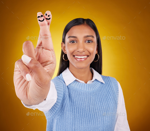 Smiley face, fingers and portrait of Indian woman in studio with ...