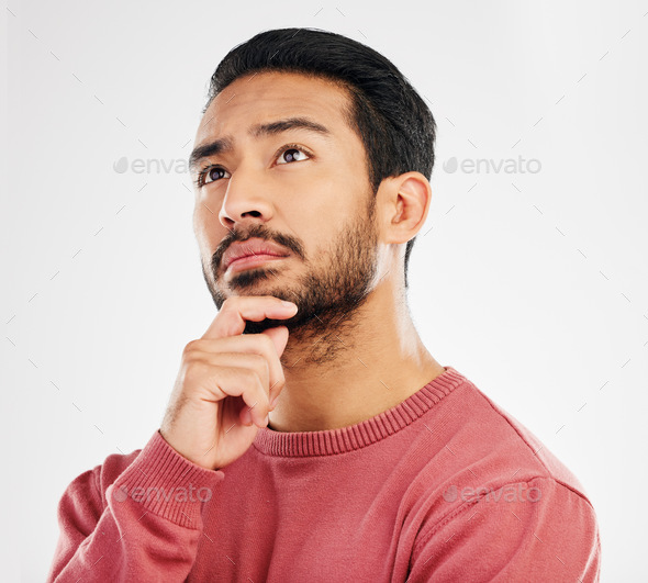 Serious man, thinking face and ideas in studio, white background and ...