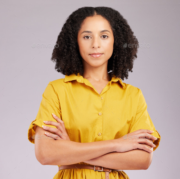 Serious, woman and portrait in studio, arms crossed and background for ...