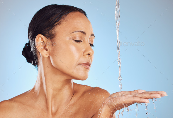 Mature, grooming and a woman catching water for beauty isolated on a ...