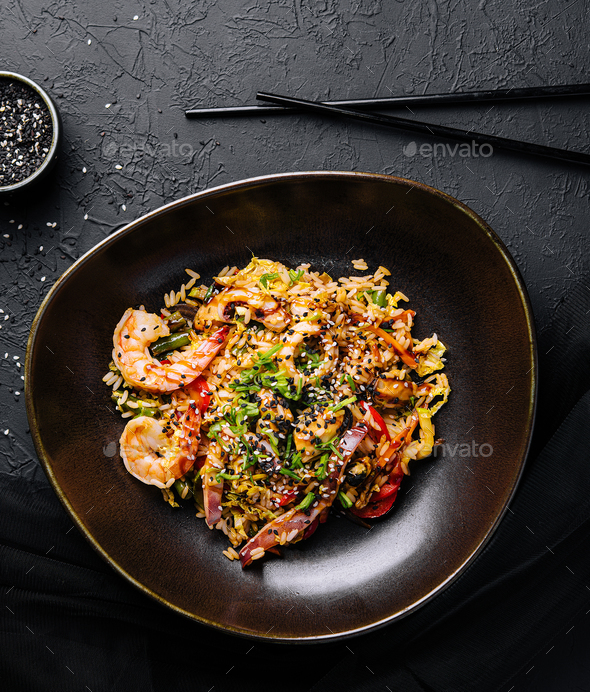 Top view of fried rice with seafood and vegetables prepared in Chinese ...