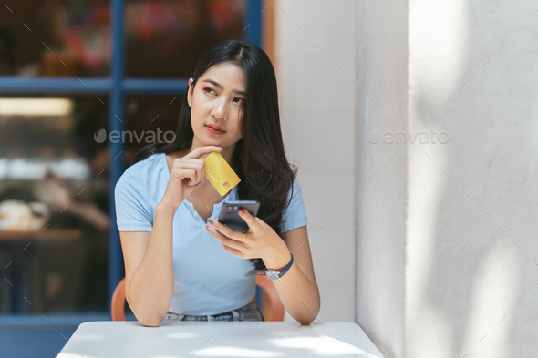 Online Banking Concept. Portrait Of Happy Young Asian Woman with ...
