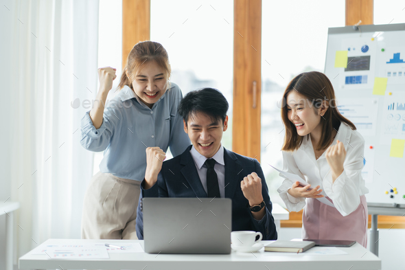 Solving problems as one team. Asian young team of male and female ...