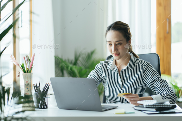 Asian woman shopping online retail store ecommerce using credit card ...