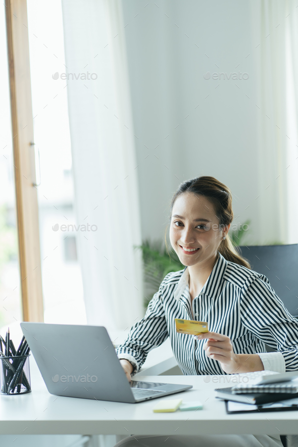 Asian woman shopping online retail store ecommerce using credit card ...