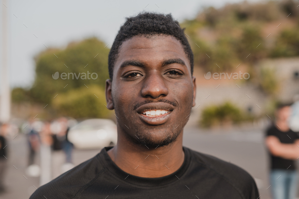 Smiling black man taking selfie Stock Photo by GabiStock | PhotoDune