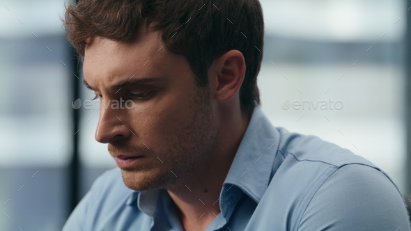 Serious director looking graphics laptop screen. Nervous manager typing ...