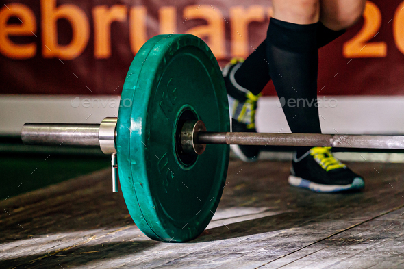 part barbell and legs powerlifter on wooden floor, powerlifting ...