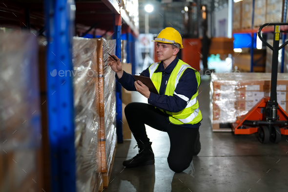 Young warehouse workers working together. Business distribution supply ...