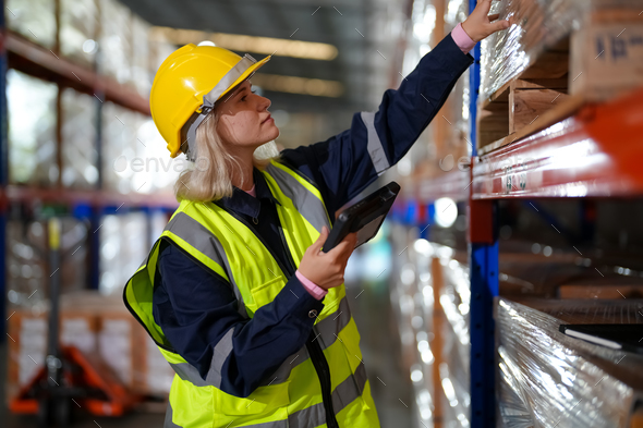 Young warehouse workers working together. Business distribution supply ...