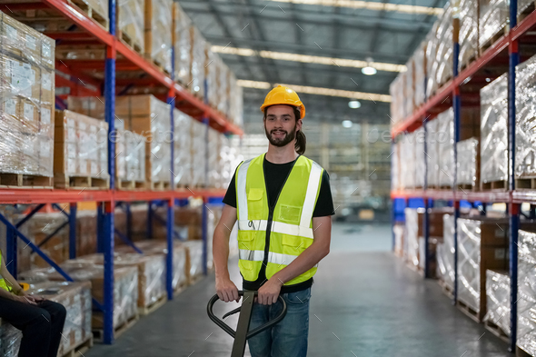 Young warehouse workers working together. Business distribution supply ...