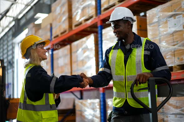 Young warehouse workers working together. Business distribution supply ...