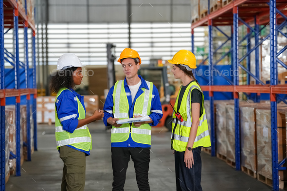 Young warehouse workers working together. Business distribution supply ...
