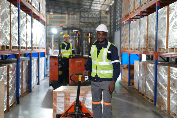 Young warehouse workers working together. Business distribution supply ...