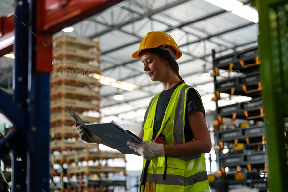 Young warehouse workers working together. Business distribution supply ...