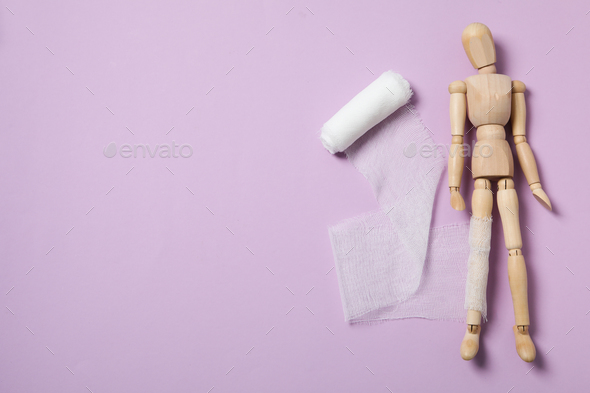 Concept of help during an injury with wooden puppet with bandage Stock ...