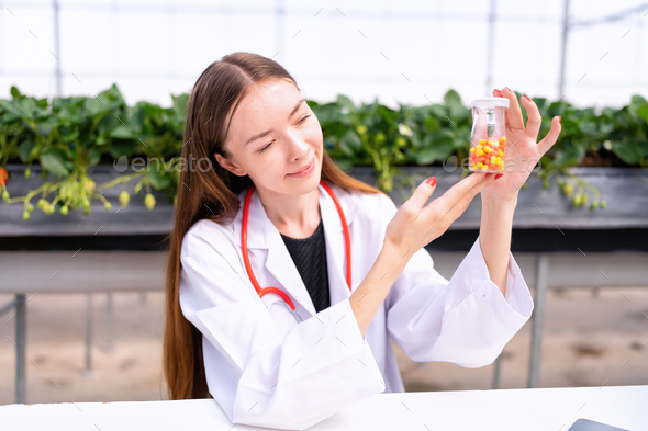 Fruit scientist researcher checking quality strawberry plant improve ...
