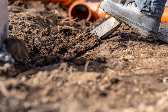 digging in the ground for plastic pipes for water and waste. Stock ...